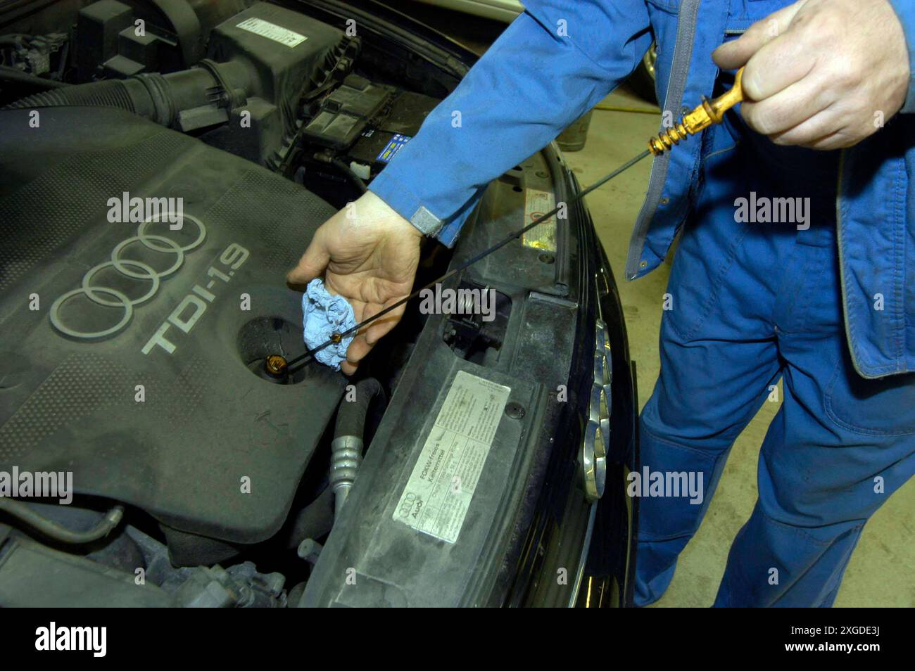 automotive mechanic works on the car to fix a problem automotive ...