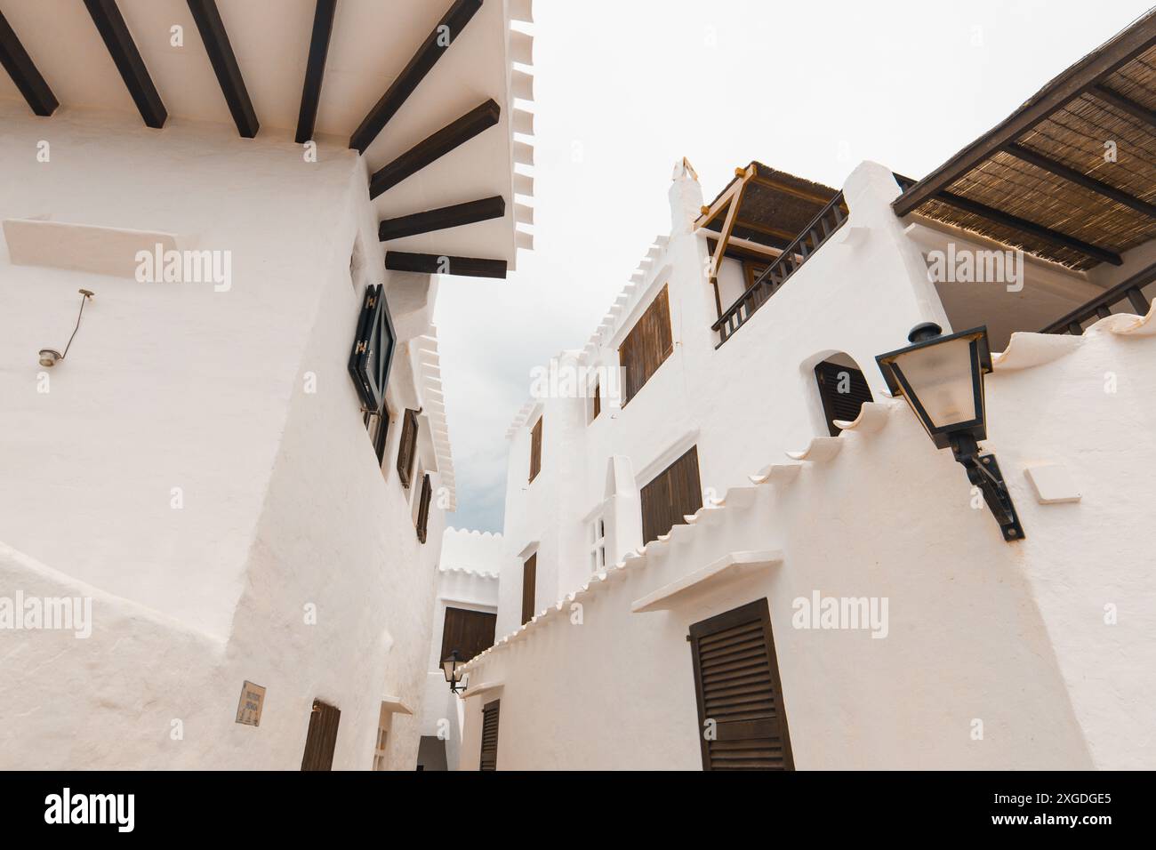 The beautiful town of Binibeca on Menorca. Narrow streets and white ...