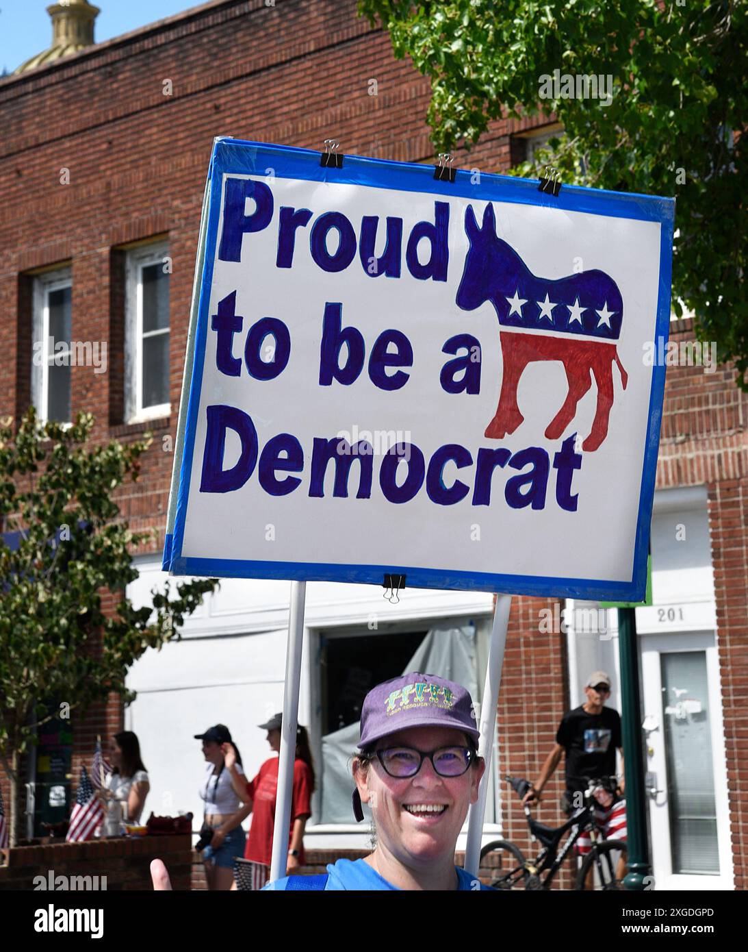 American Democratic Party supporters with signs march in a 2024 Fourth ...