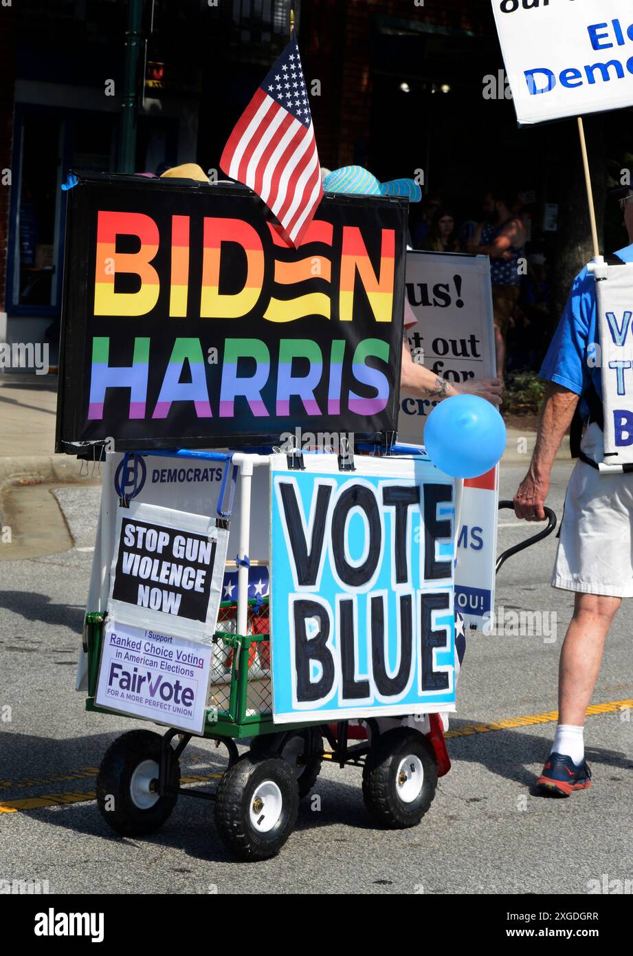American Democratic Party supporters with signs march in a 2024 Fourth ...
