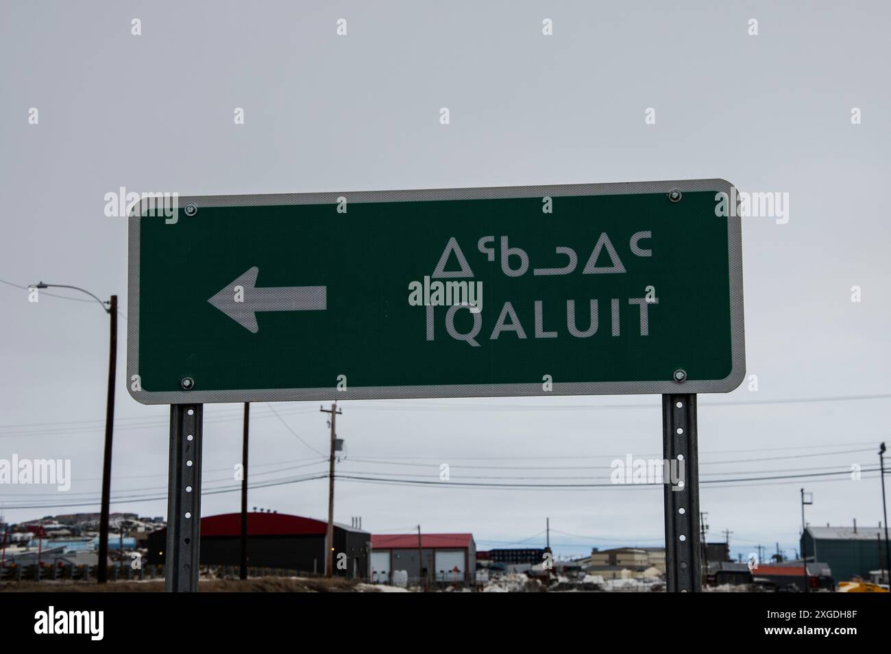 Bilingual directional sign in English and Inuktitut to Iqaluit at ...