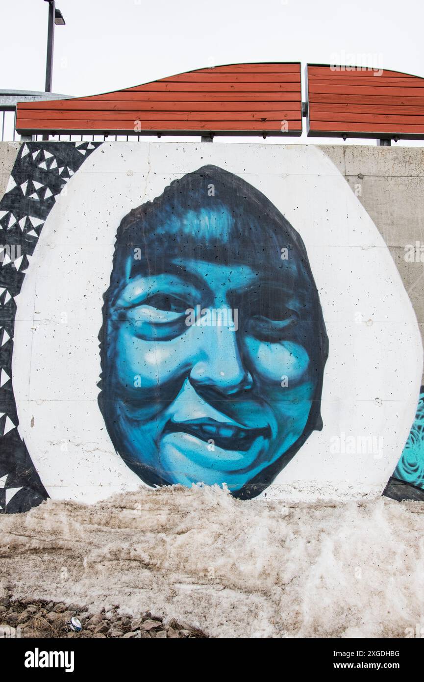 Portrait of faces mural under the theme of "Come Together" at Qikiqtani ...