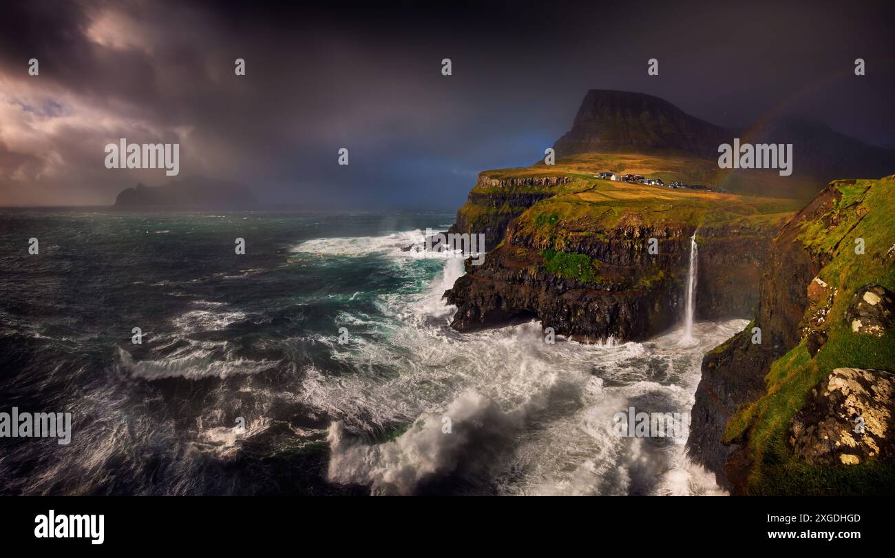 Storm at the waterfall and cliffs of Gasadalur, Faroe Islands, Denmark ...
