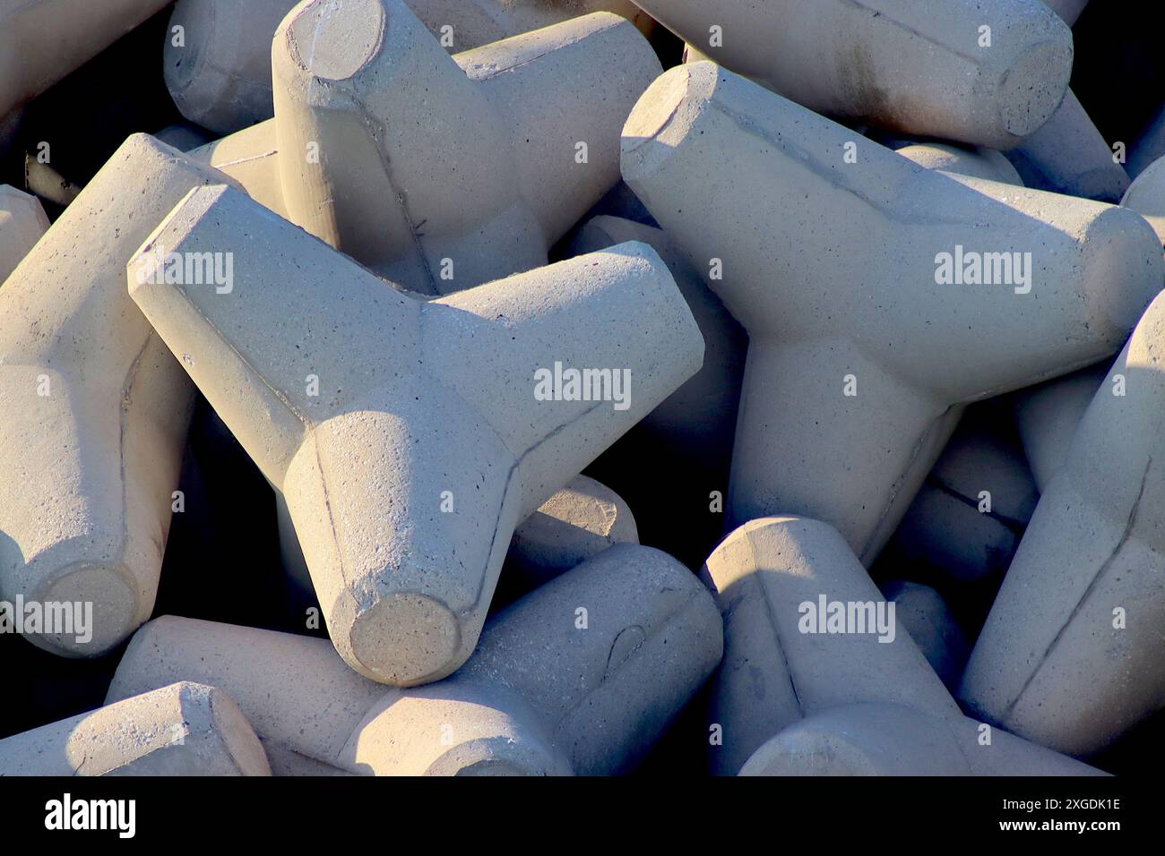 Close up of a cluster of concrete breakwater blocks in random ...