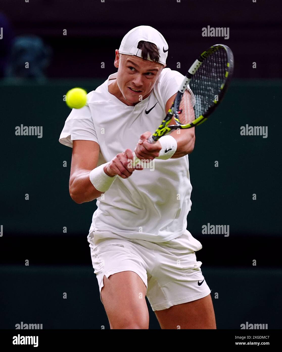 Holger Rune in action against Novak Djokovic on day eight of the 2024 ...