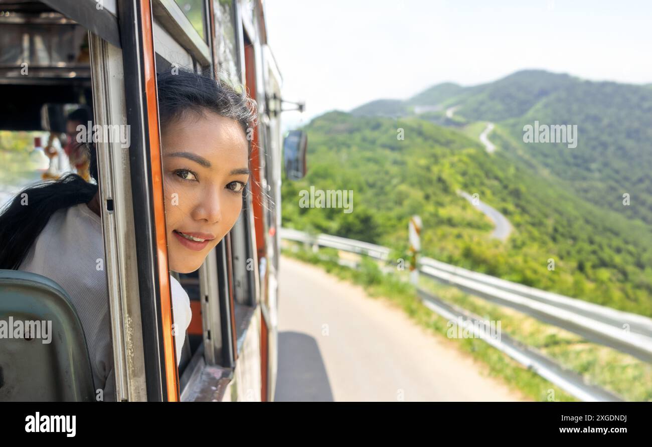 Woman looking out bus window hi-res stock photography and images - Alamy