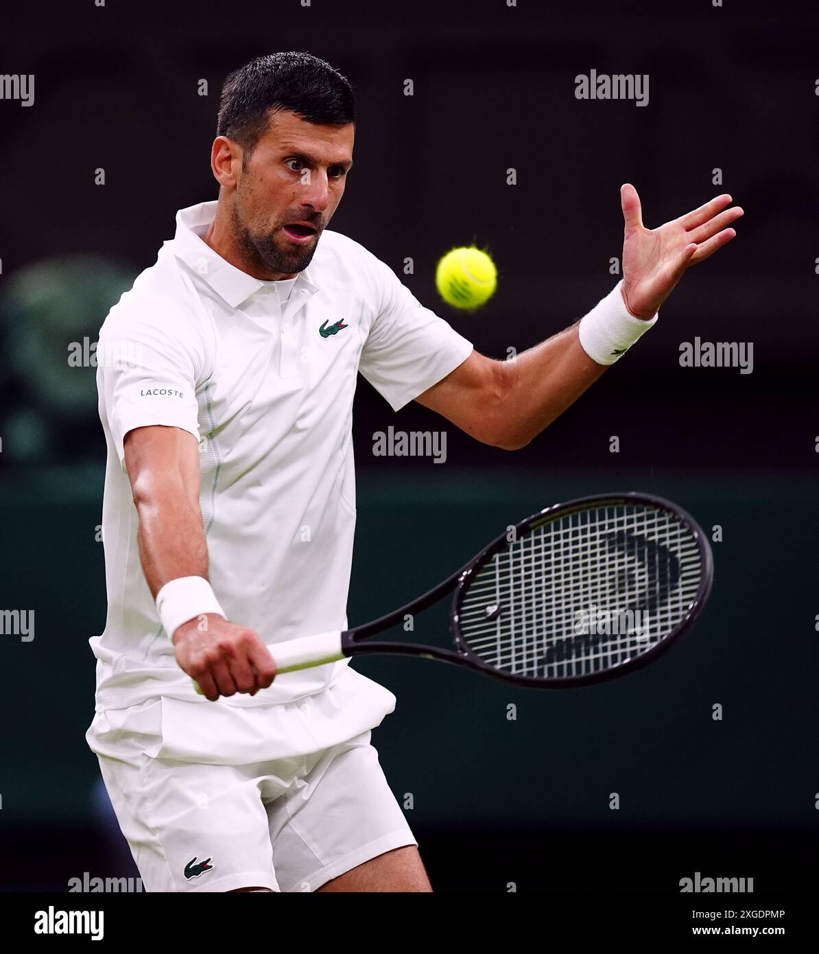 Novak Djokovic in action against Holger Rune on day eight of the 2024 Wimbledon Championships at ...