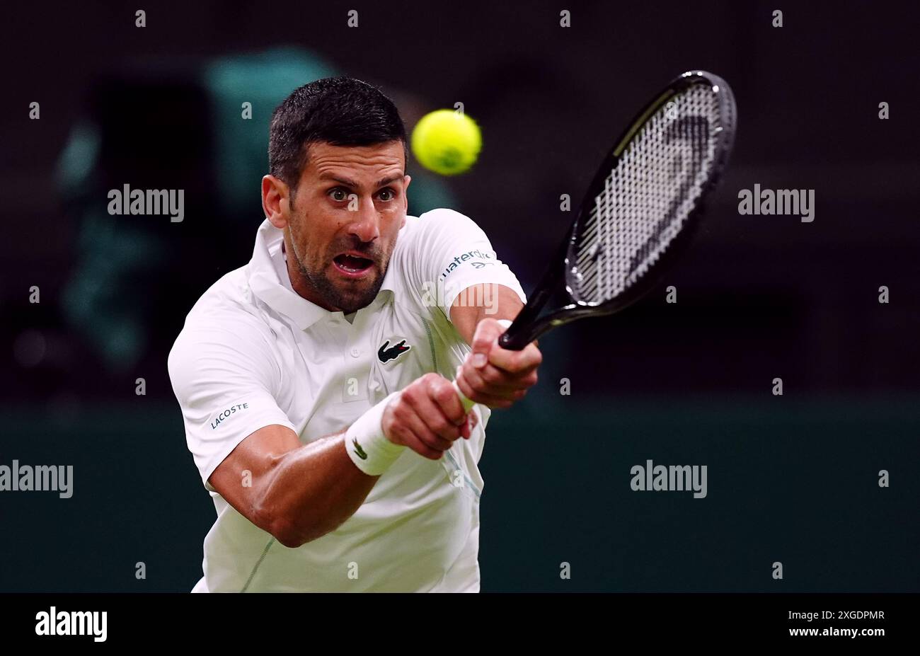 Novak Djokovic in action against Holger Rune on day eight of the 2024 Wimbledon Championships at ...