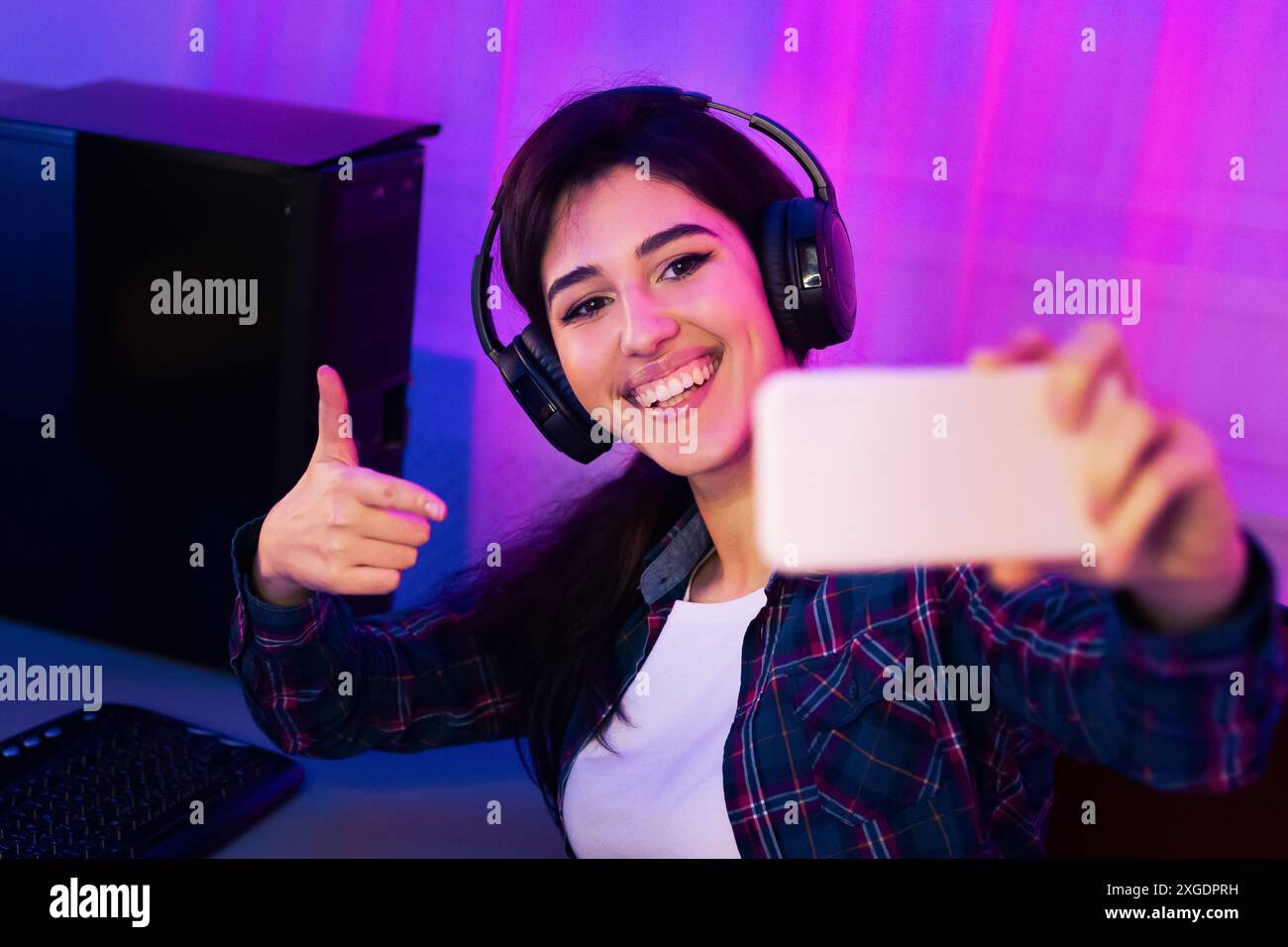 Smiling Gamer Woman Taking Selfie In Gaming Room With Headphones Stock ...