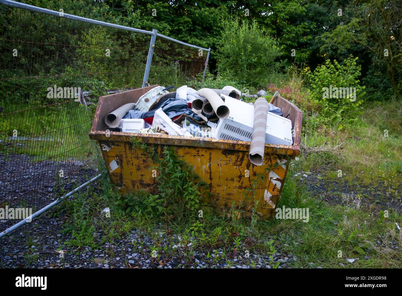 A garbage skip container full of household waste in the UK Stock Photo ...