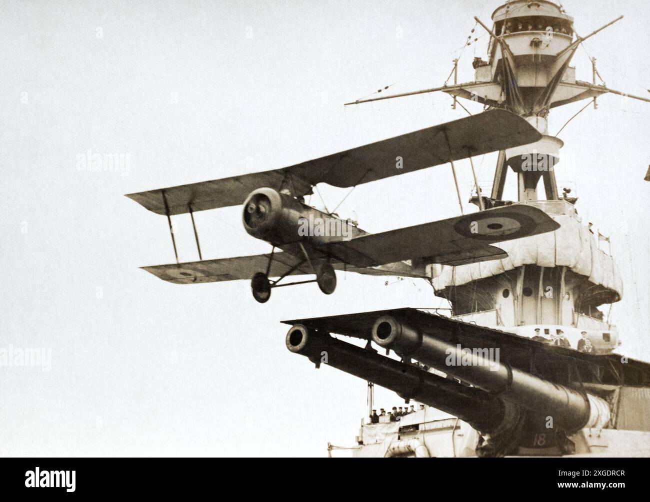 A biplane launching from the battleship HMS Barham c. 1918-1931 Stock ...