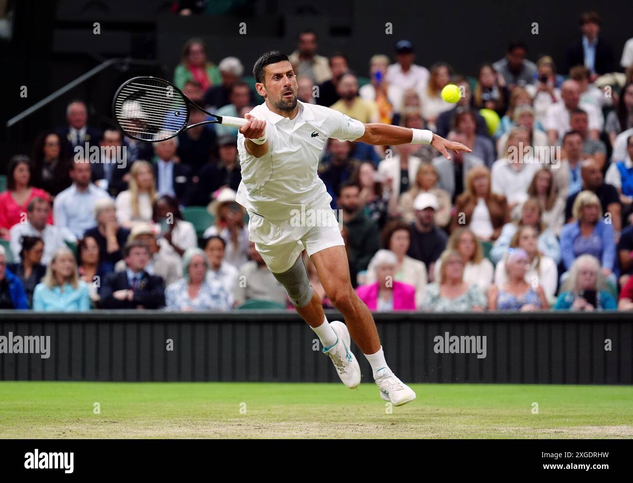 Novak Djokovic in action against Holger Rune on day eight of the 2024 Wimbledon Championships at ...