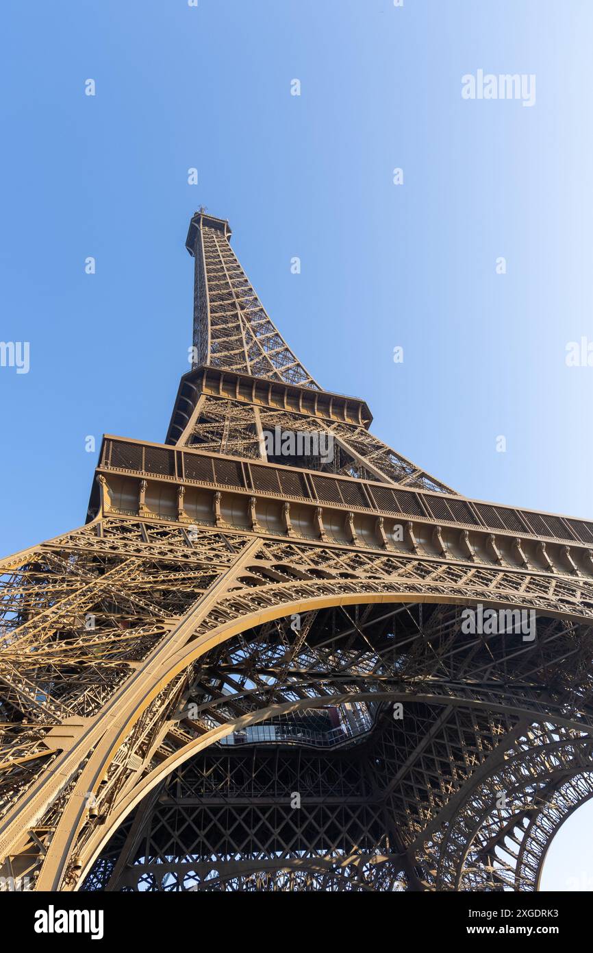 Base structure of Eiffel tower in Paris, France. Early golden morning ...