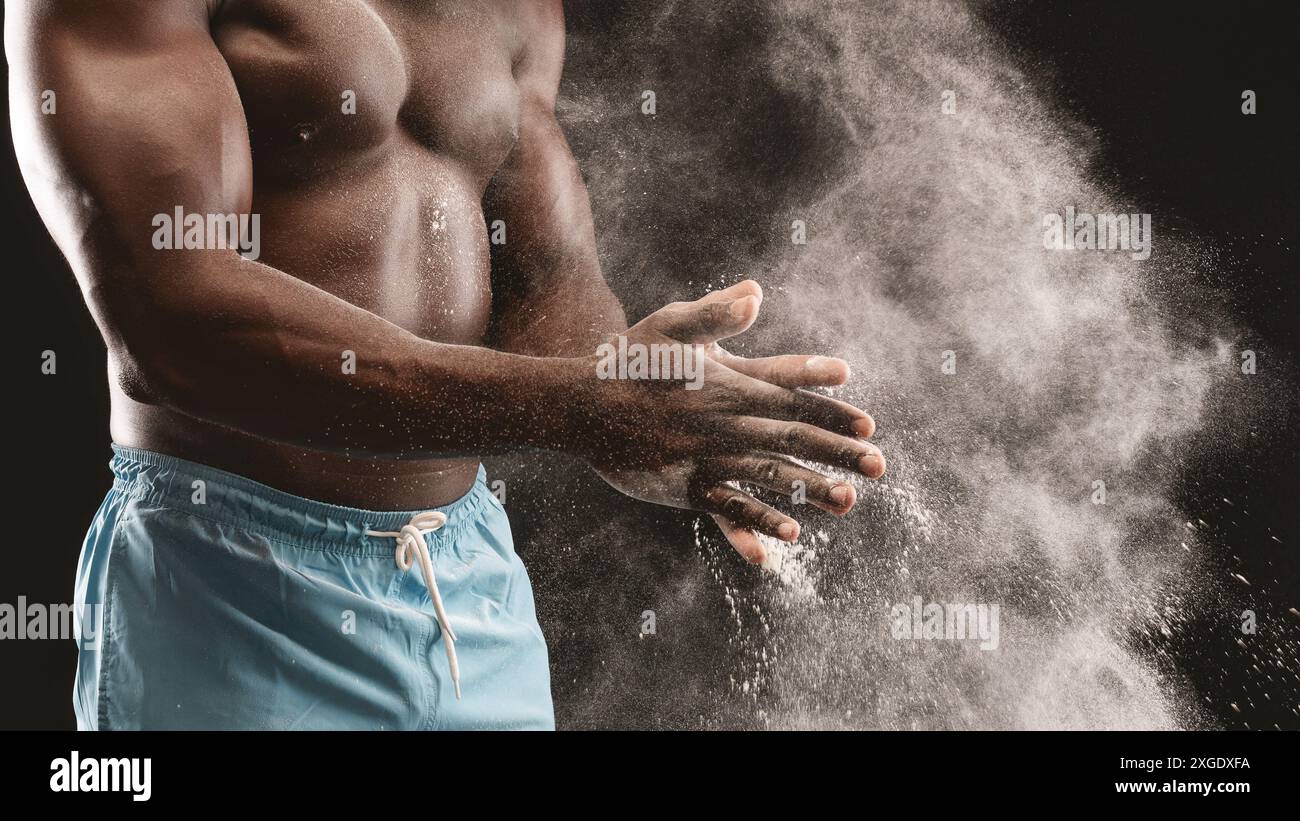 Man Clapping Powder on Hands Before Workout Stock Photo - Alamy