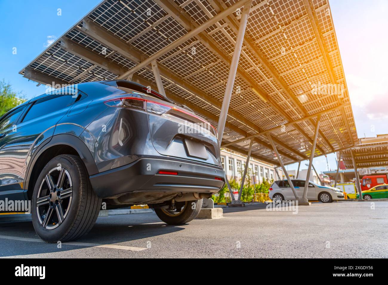 Solar panels installed over parking lot with parked cars for effective ...