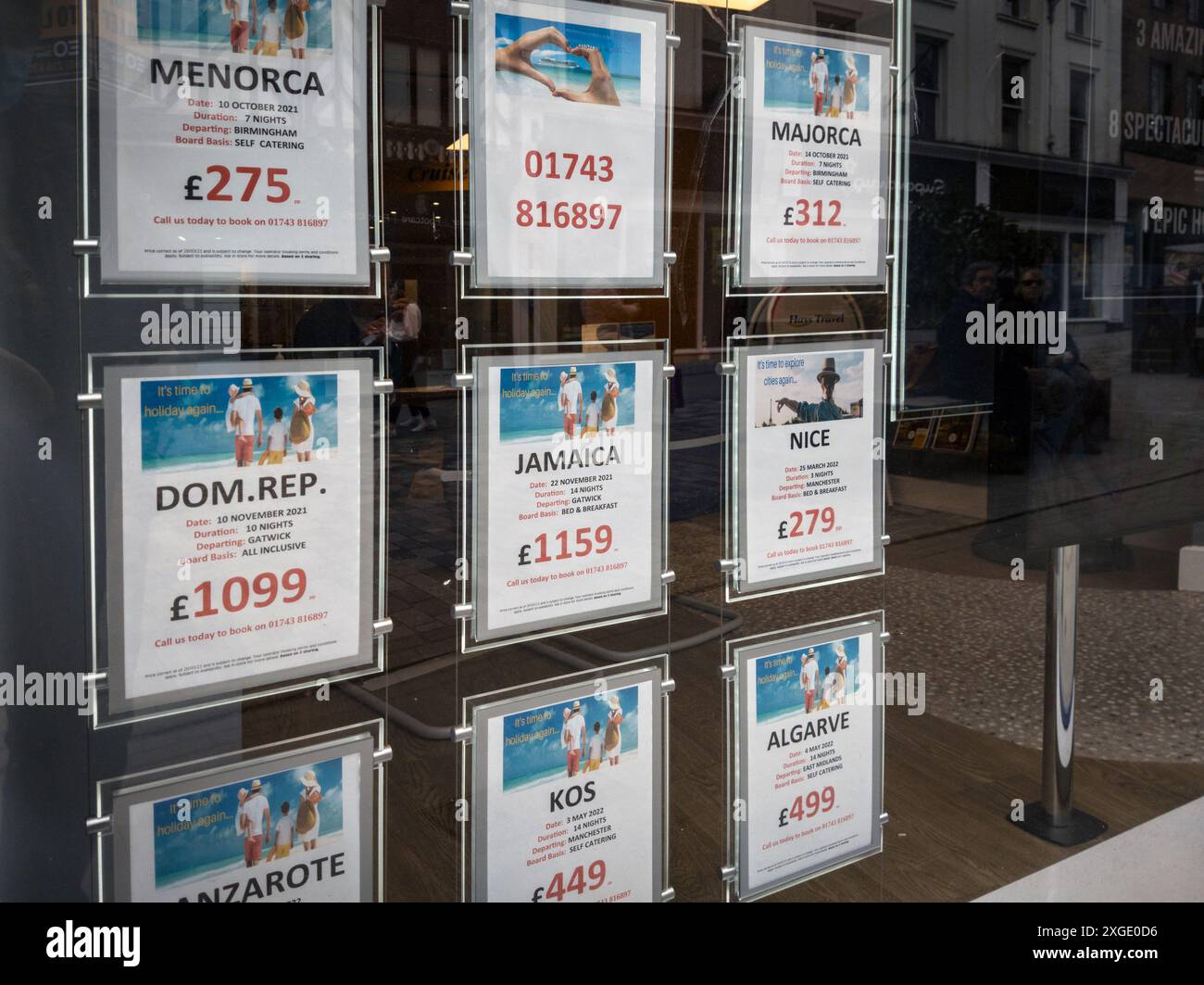 Travel agent's window in British high street Stock Photo - Alamy