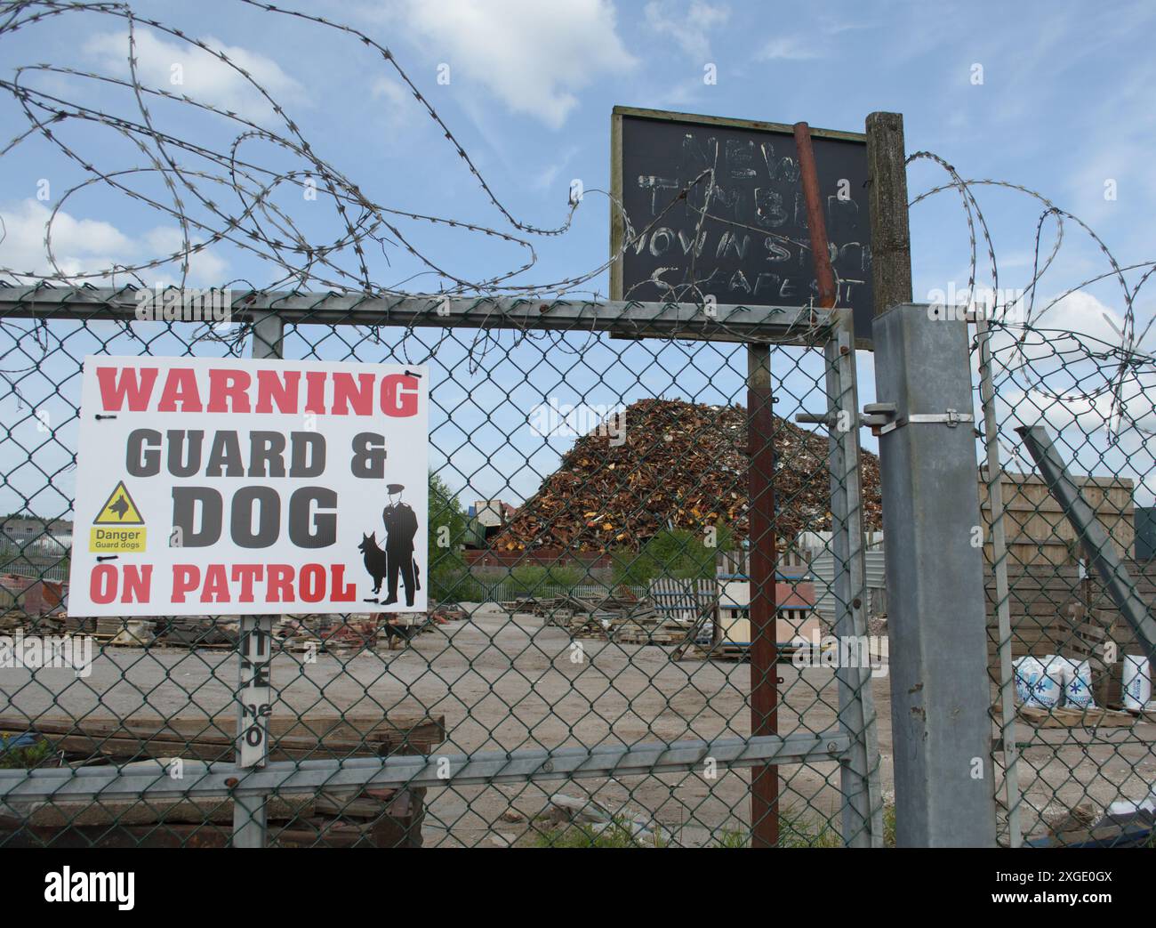 Warning sign at entrance to metal recycling scrap yard, Widnes ...