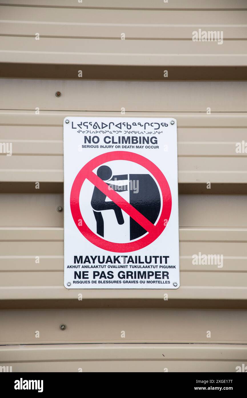 Multilingual no climbing sign in English, French, Inuktitut and ...