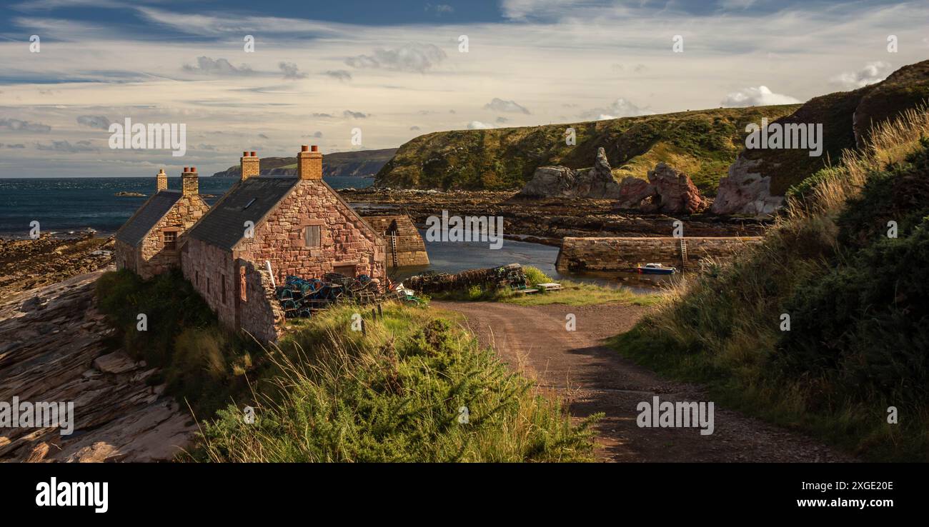 Small harbour in the village of Cove, east coast of Scotland, with two ...