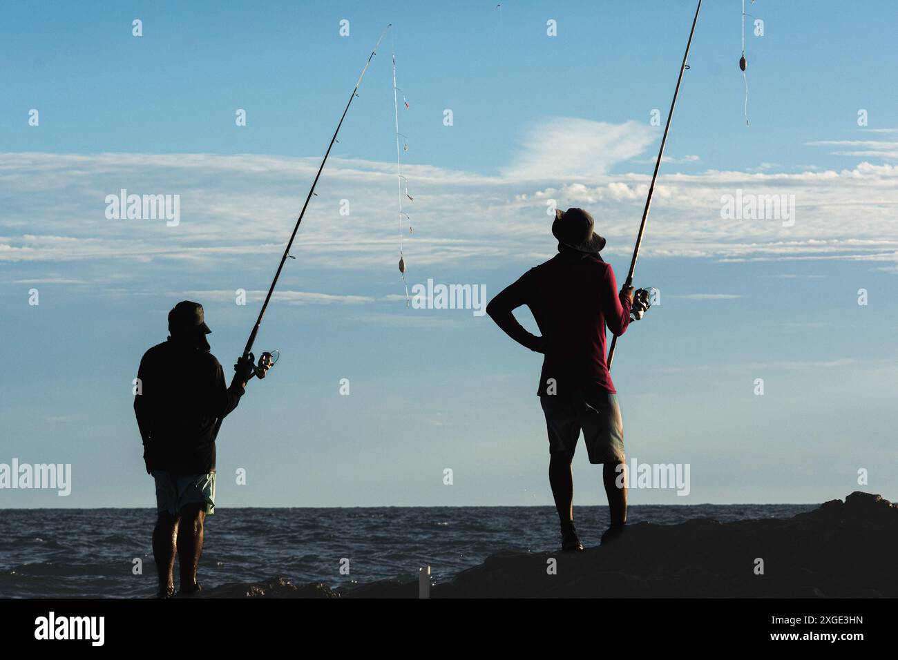 Salvador, Bahia, Brazil - May 17, 2019: Two fishermen, in silhouette ...