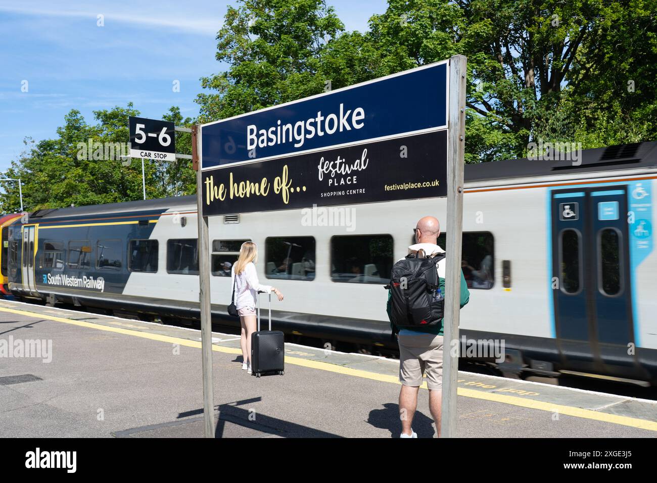 People waiting on a platform at Basingstoke train station for a South ...