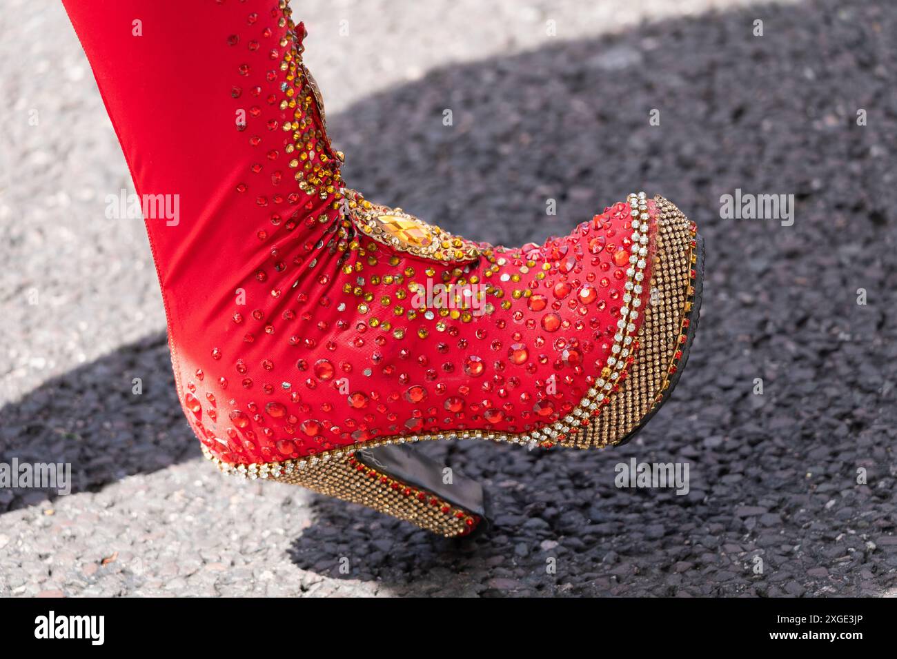 Closeup of a flamboyantly clad foot with a high heeled boot with ...