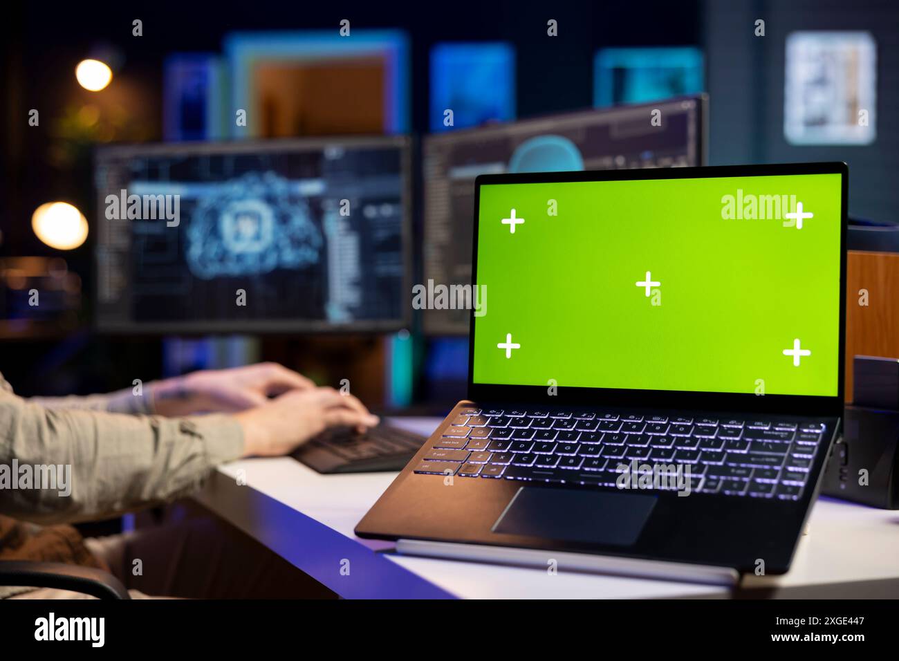 Green Screen Laptop Next To Man Updating Artificial Intelligence Neural Networks Writing Binary