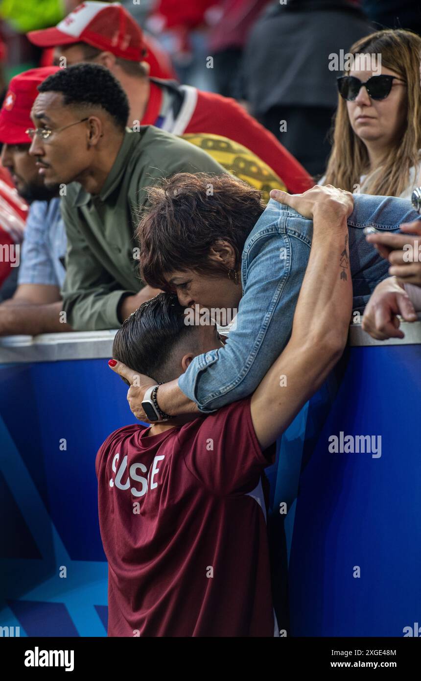 DUSSELDORF, GERMANY - JULY 6: Cedric Zesiger of Switzerland kisses by ...