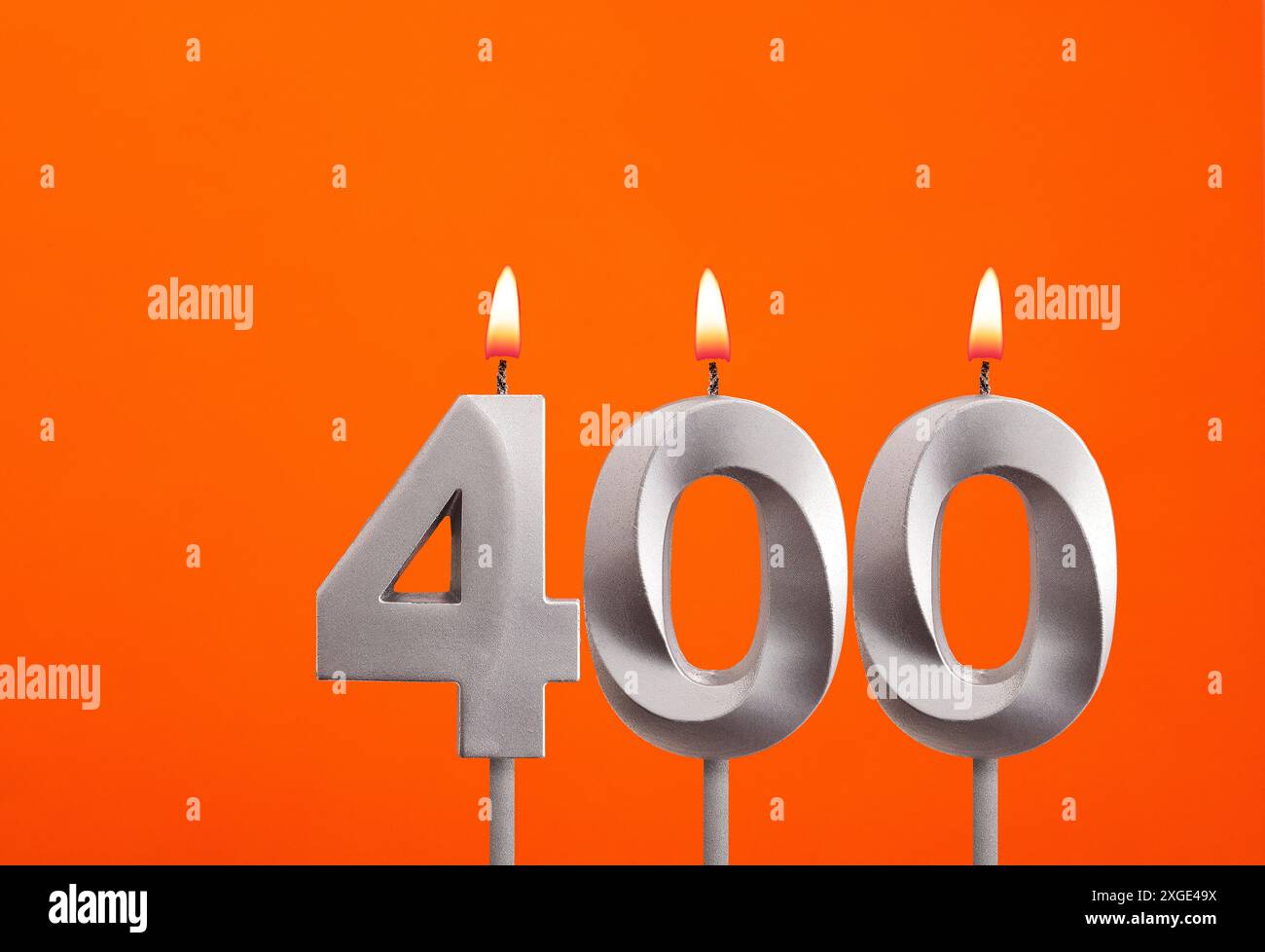 Candle number 400 - Birthday in orange background Stock Photo - Alamy