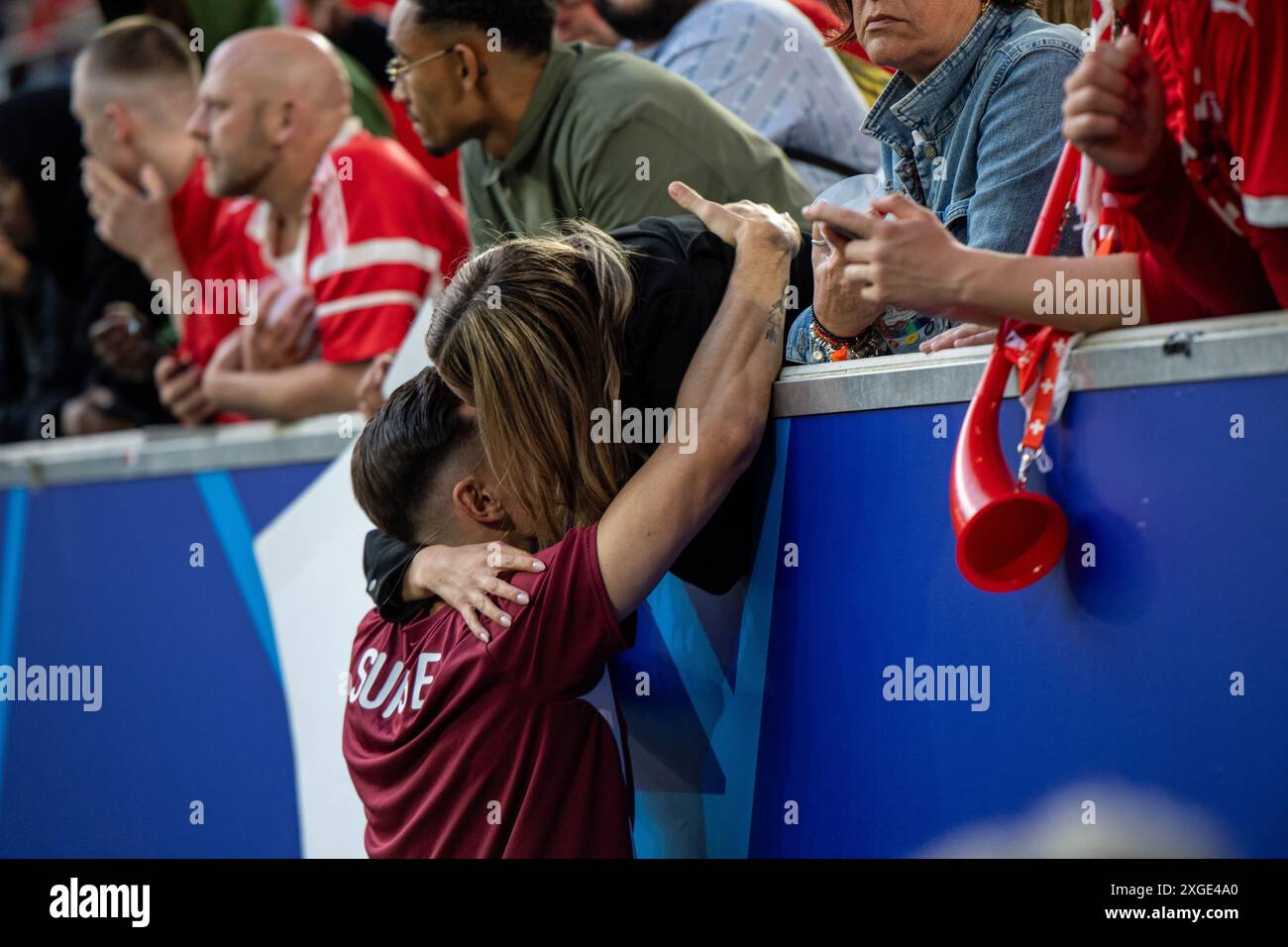 DUSSELDORF, GERMANY - JULY 6: Cedric Zesiger of Switzerland kisses with ...