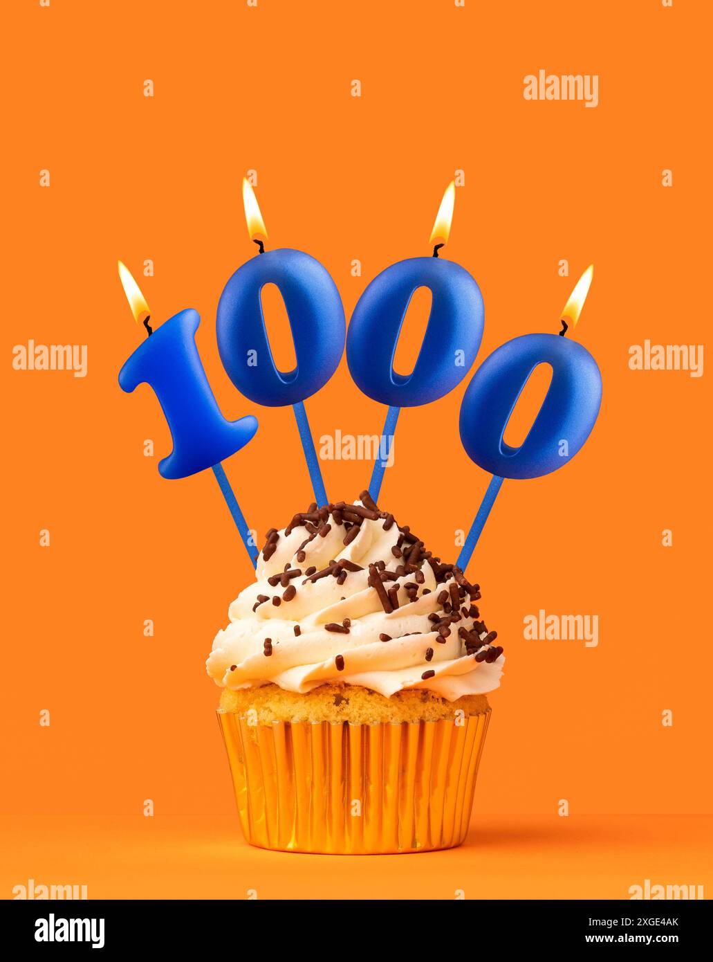 Blue birthday candle and cupcake - Number 1000 Stock Photo - Alamy