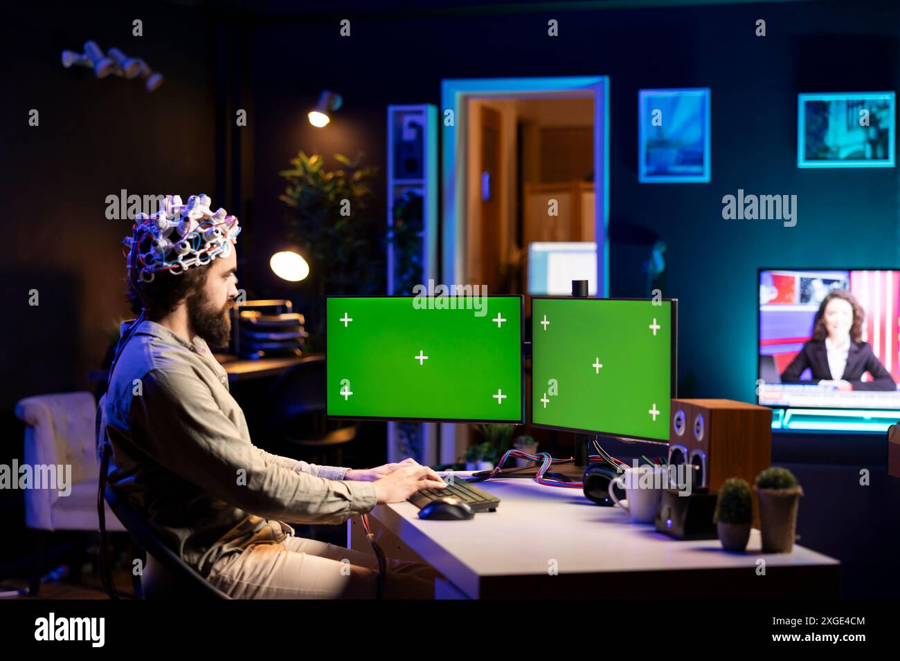 Software engineer with EEG headset starting mind upload on isolated screen multi monitor setup ...