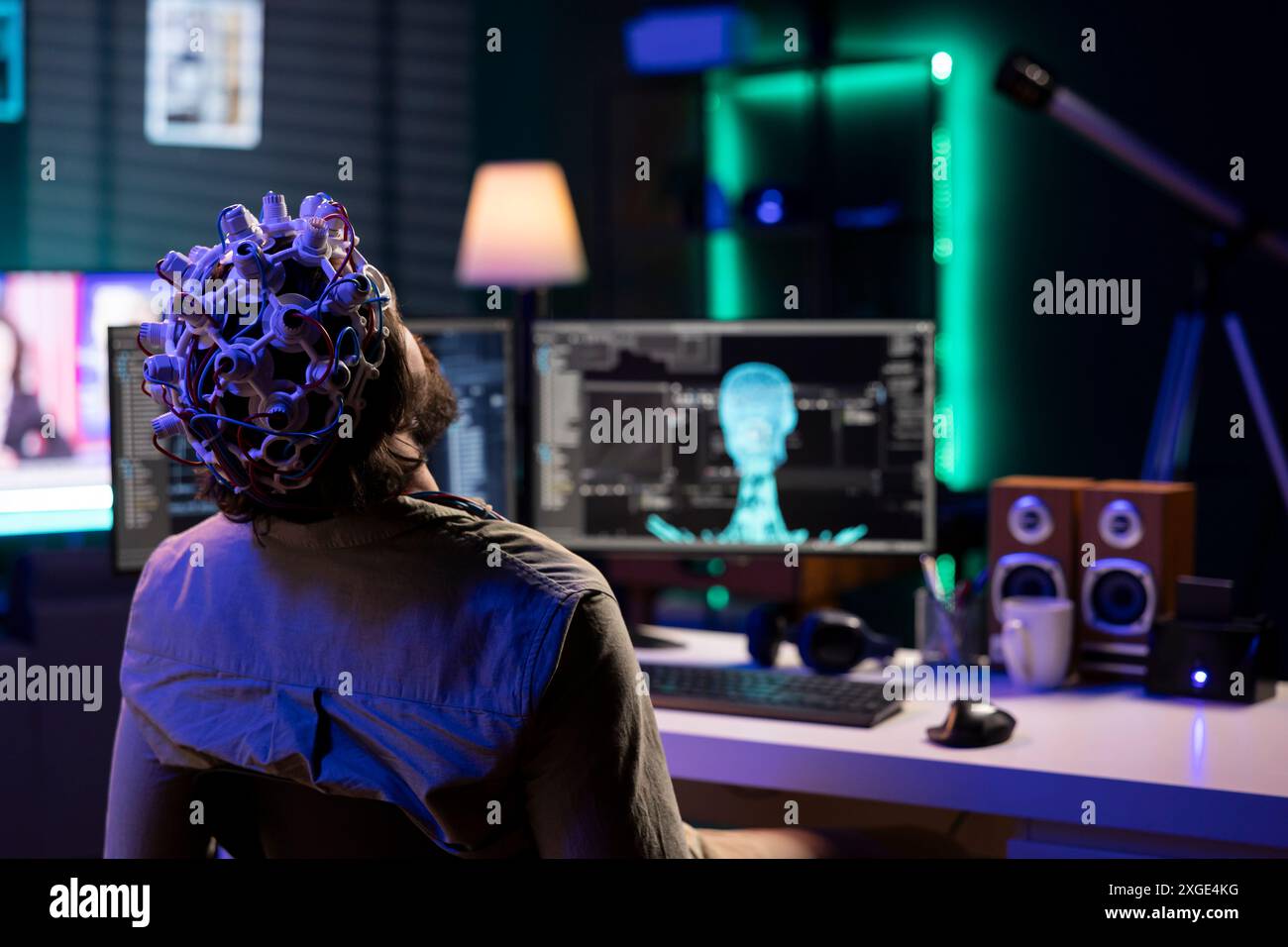 Computer technician entering trance, wearing EEG headset on head to ...