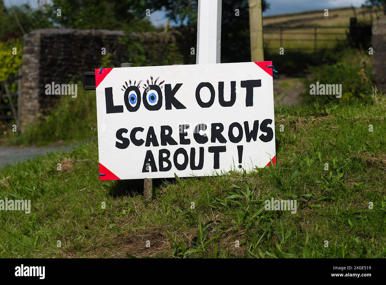Rainow scarecrows sign Stock Photo - Alamy