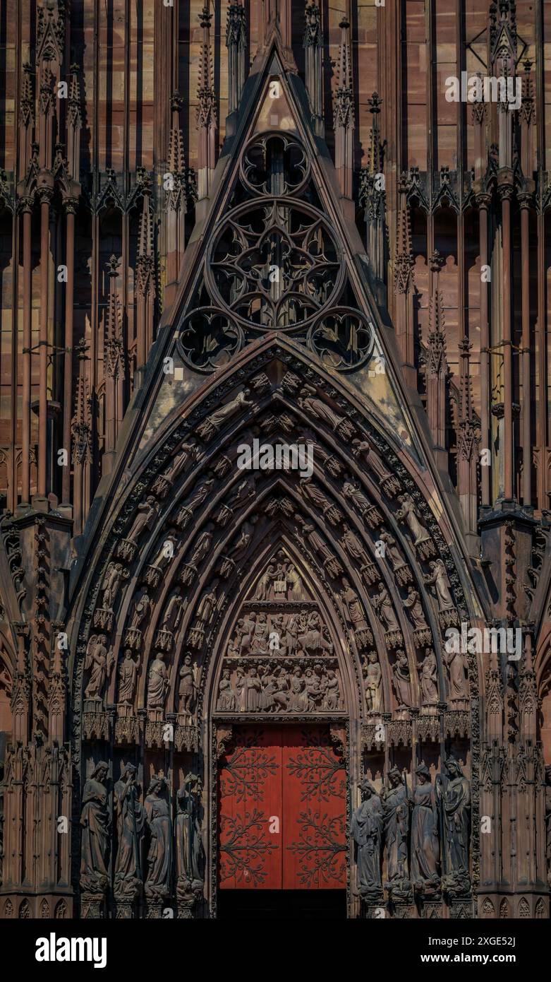 Ornate Gothic facade and main entrance gate of Notre Dame Cathedral ...