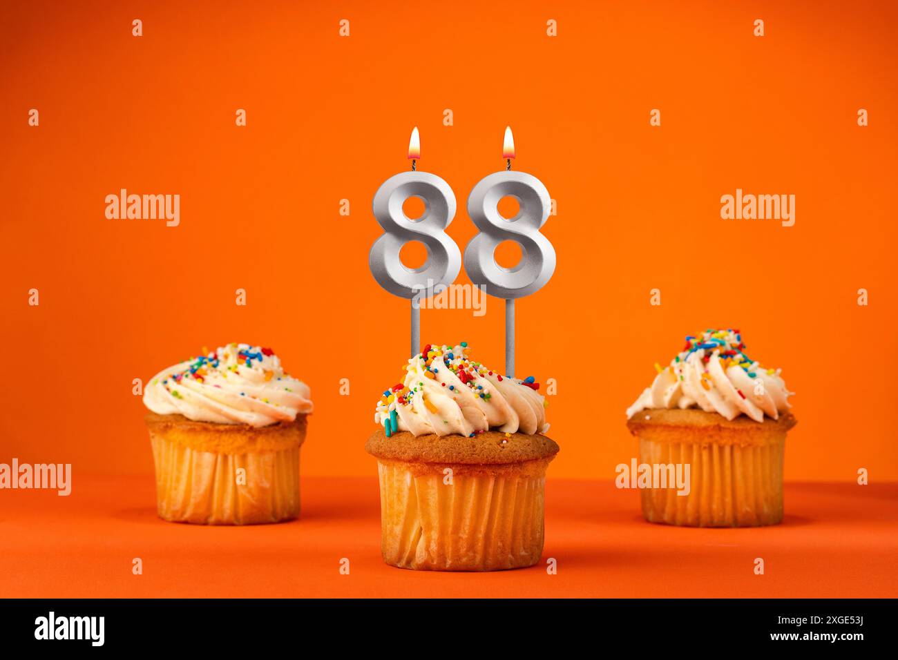 Birthday celebration in orange color - Candle number 88 Stock Photo - Alamy