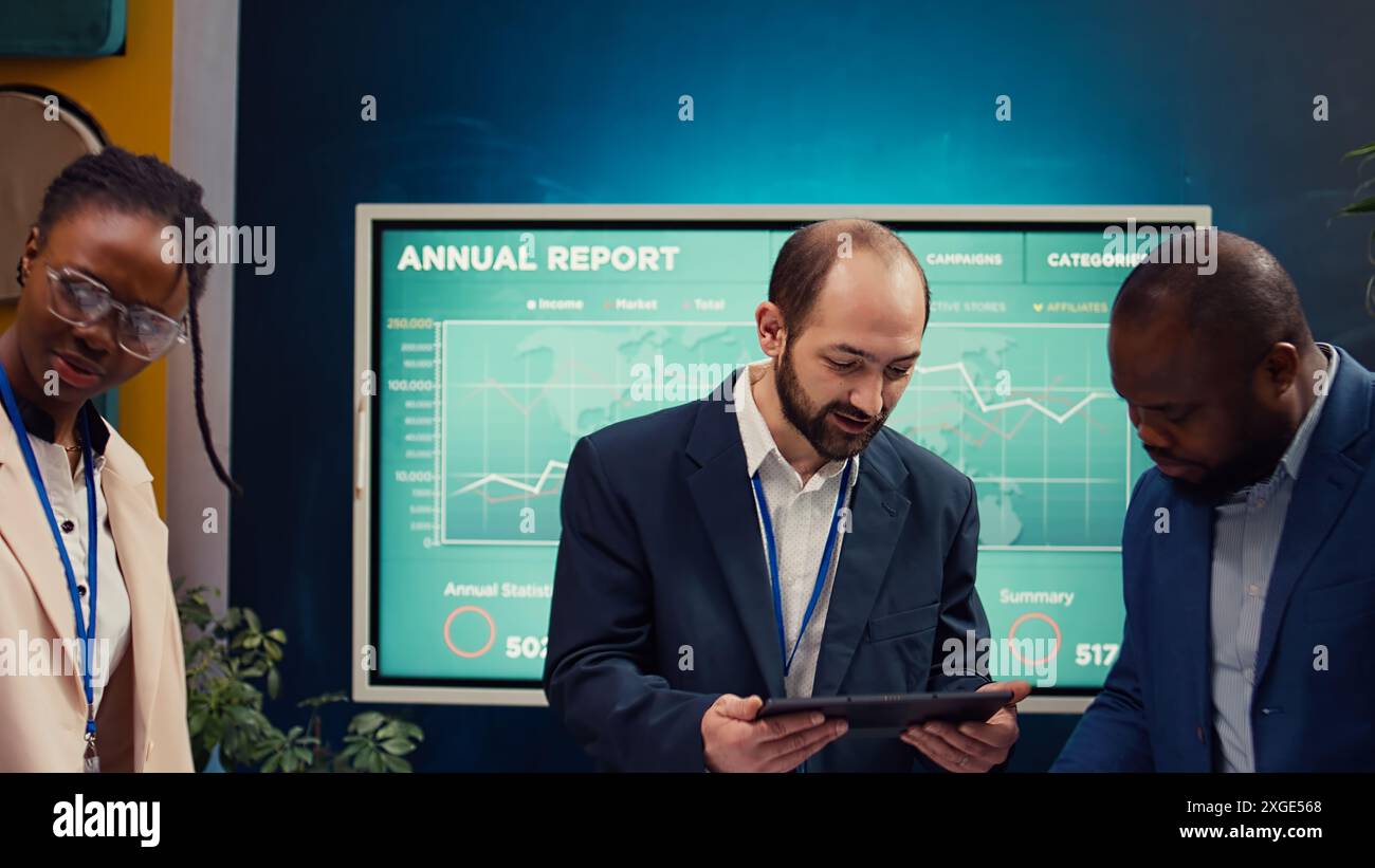 Startup colleagues reviewing data to improve customer satisfaction and ...