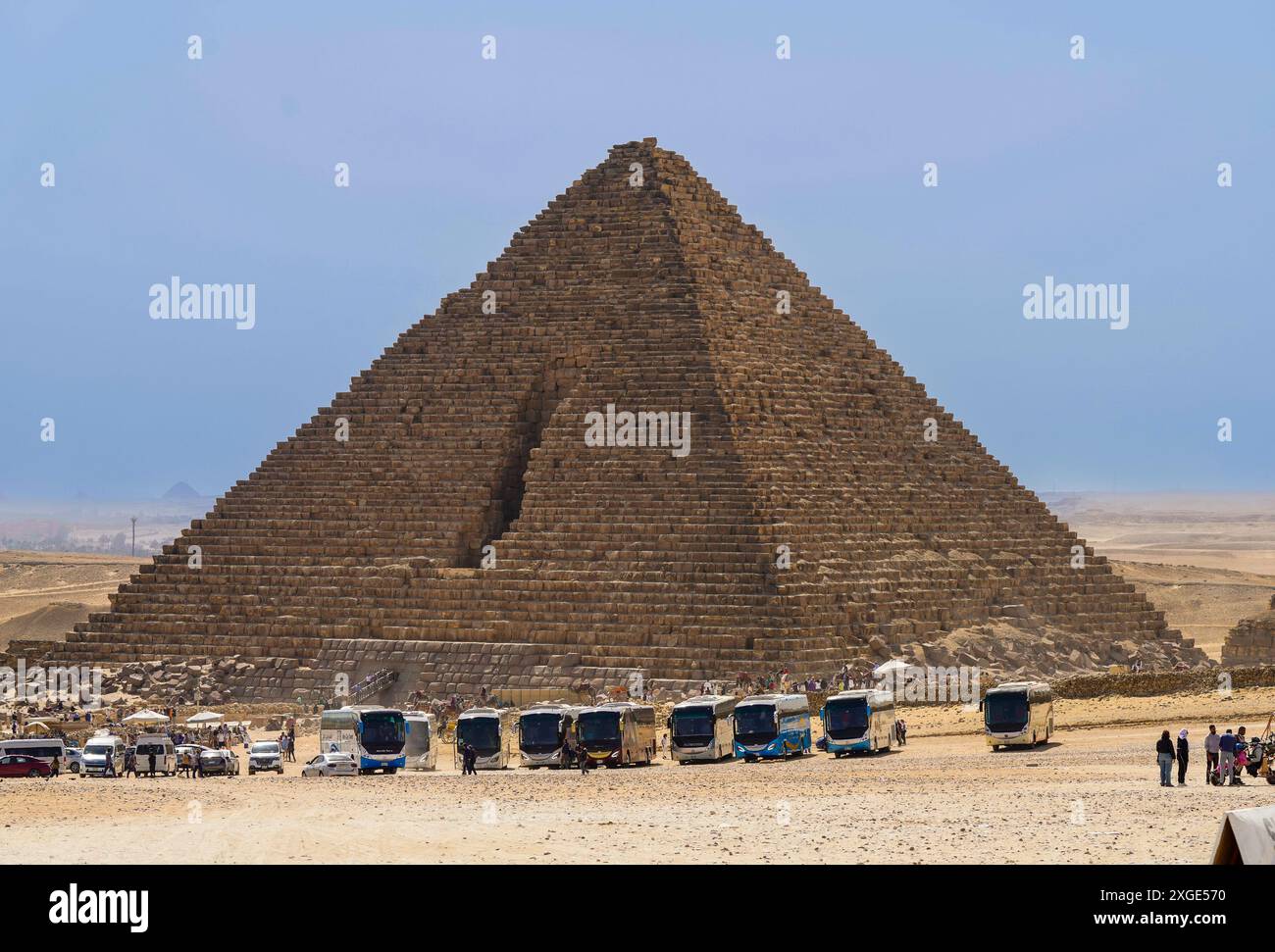 Tourist buses line up at one of the pyramids along the Giza Plateau ...