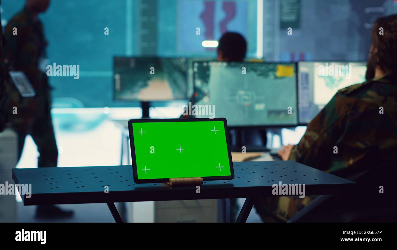 Tablet with greenscreen display running in a command post base of ...