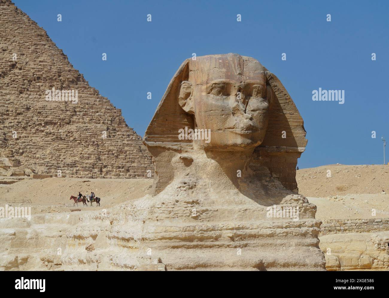 The Sphinx sits in front of the Great Pyramids along the Giza Plateau ...