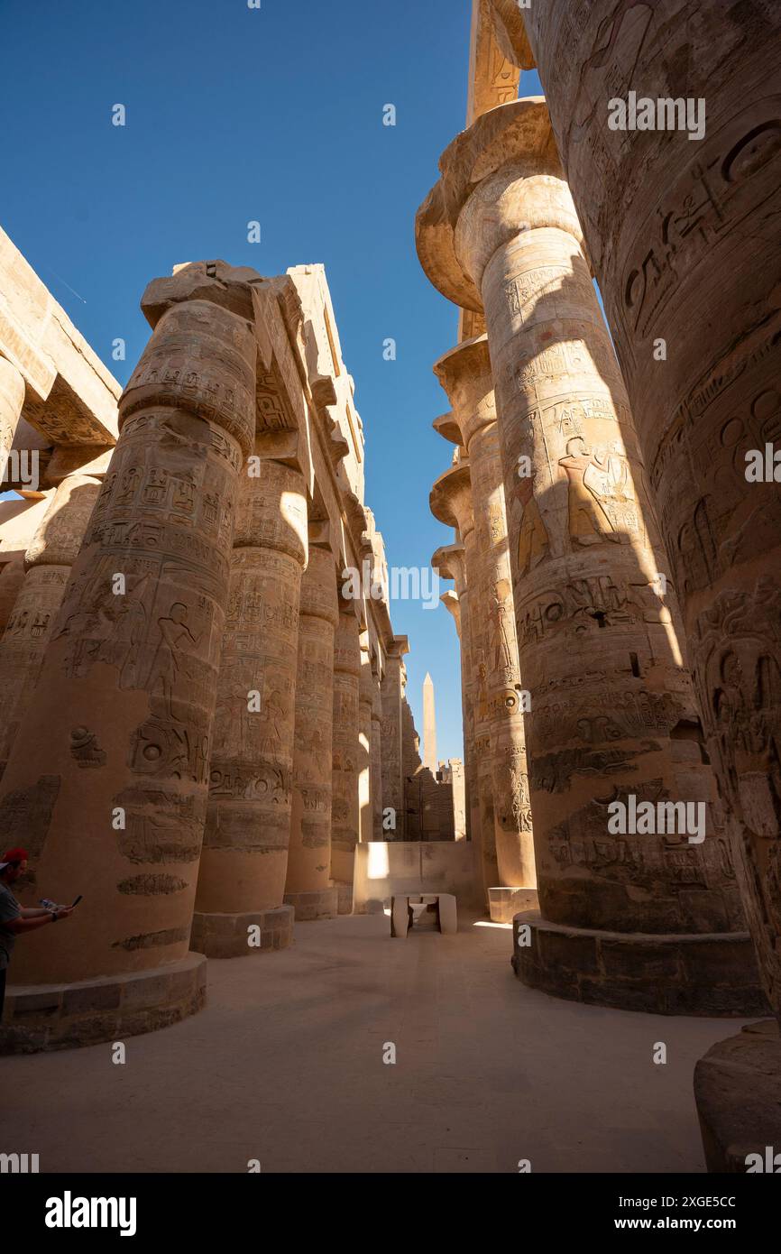 Visitors stroll through the famed Karnack Temple in Egypt Stock Photo ...
