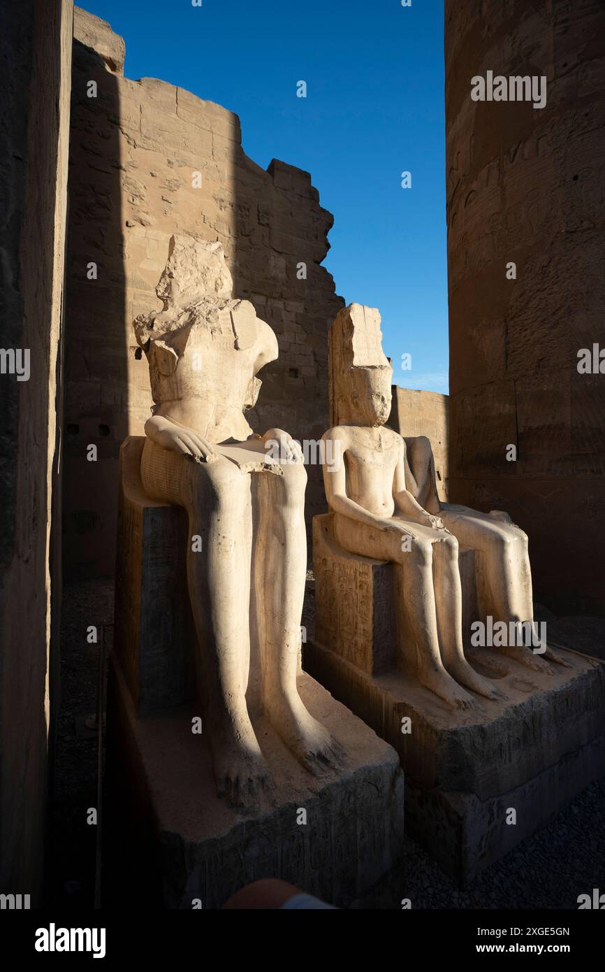 Visitors stroll through one of the ancient Egyptian temples. Tourism ...