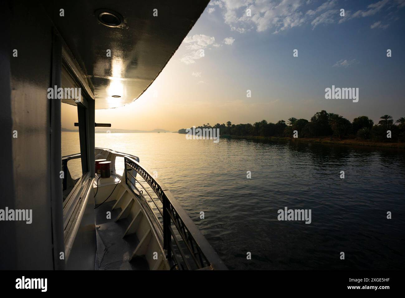 An evening setting sun while cruising along the Nile River Stock Photo ...