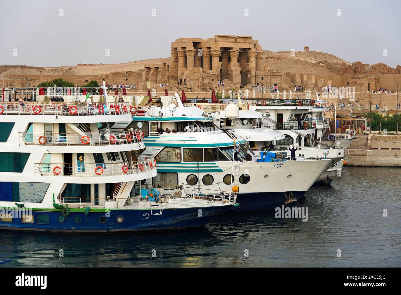 Tourist river cruise ships dock in front of the Kom Ombo Temple, the ...