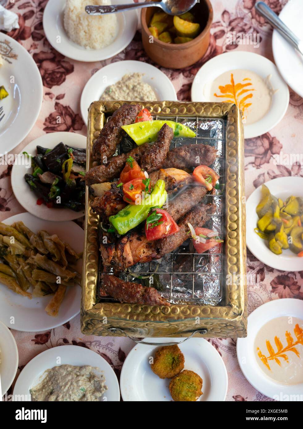 A lunchtime feast of Egyptian foods featuring grilled chicken and mixed ...