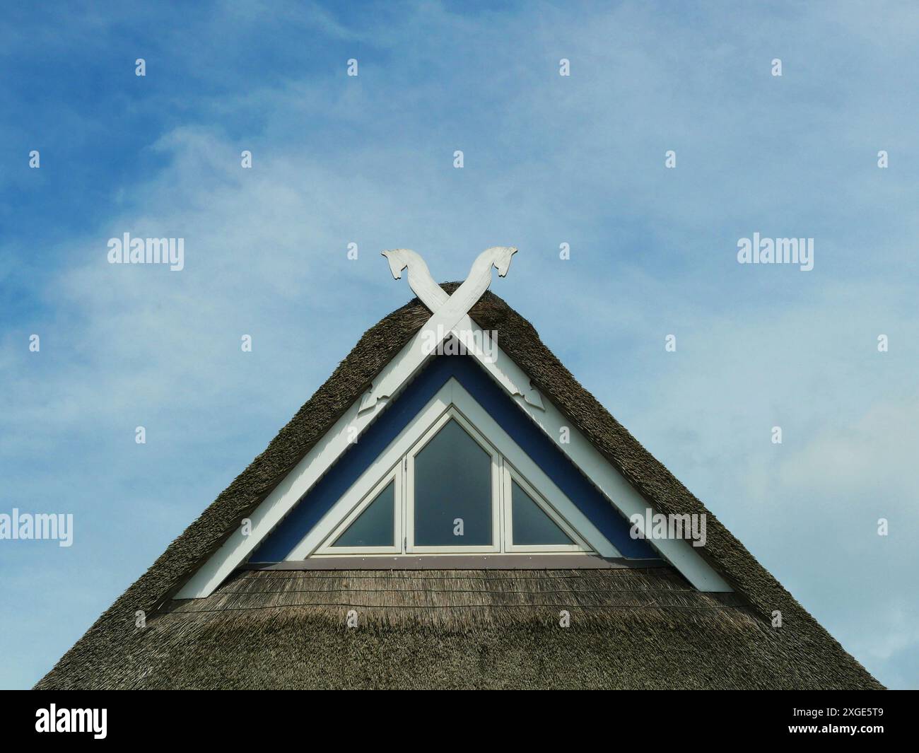 The typical historical gable ornaments on old buildings, featuring two ...