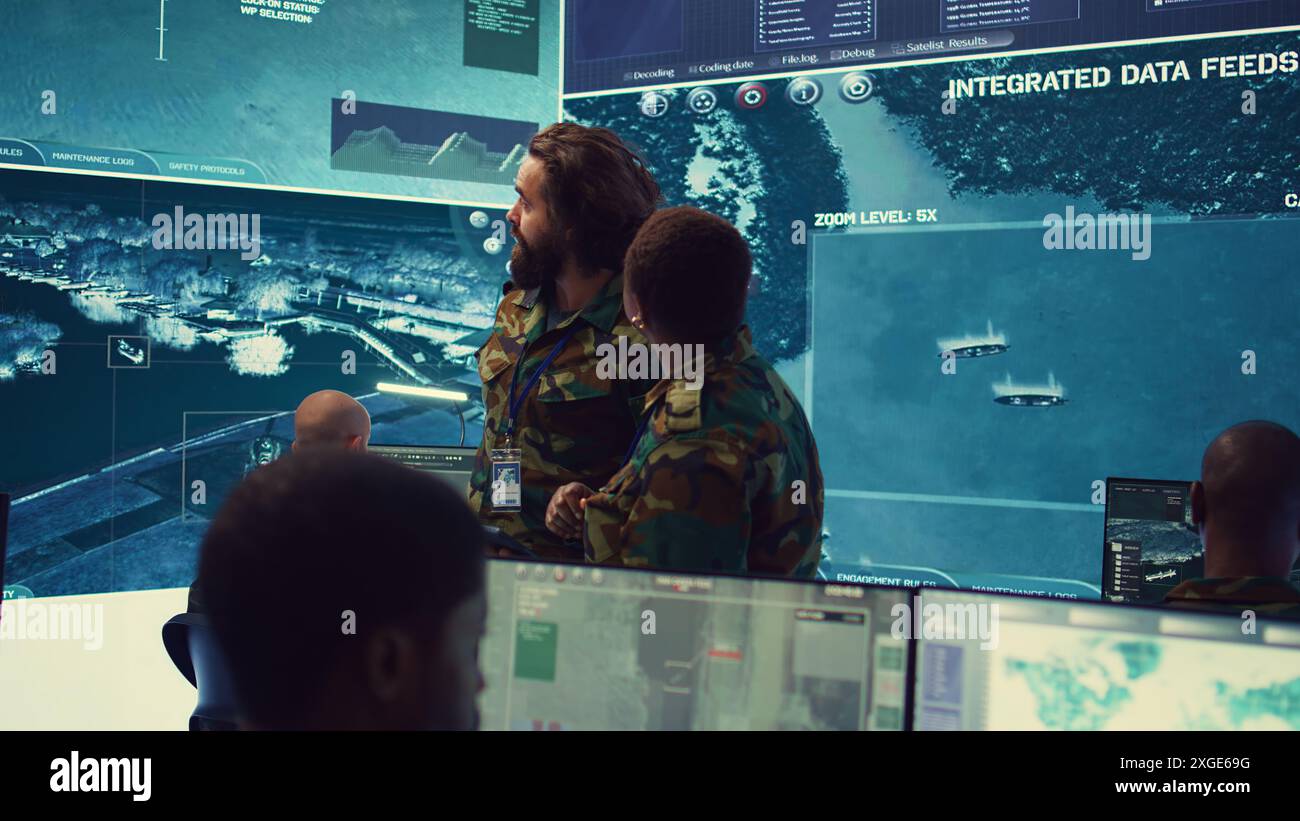 Diverse team of army officers reviewing important information from the ...