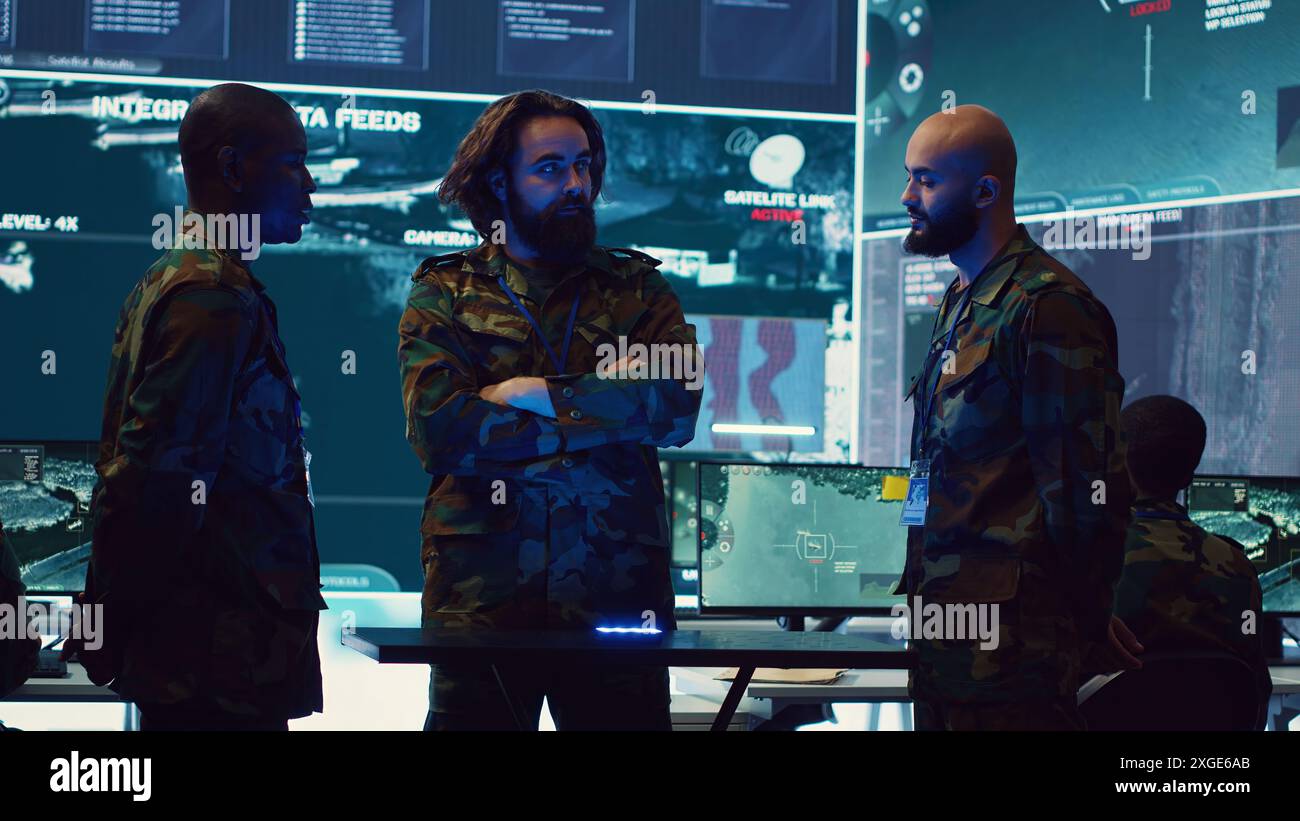 Army superior officers creating an attack plan using a hologram to ...