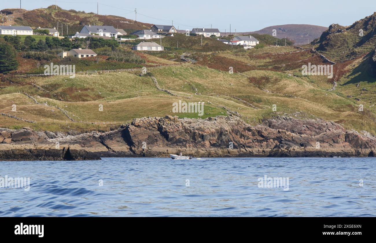 White modern houses hillside County Donegal overlooking sea and ...