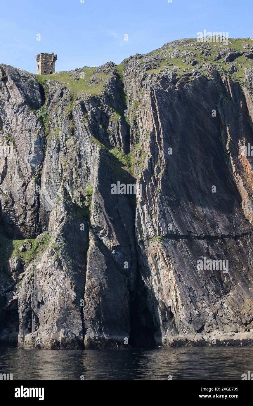 Coastal sea rockface b Ireland Carrigan Head and Napoleonic tower coast ...